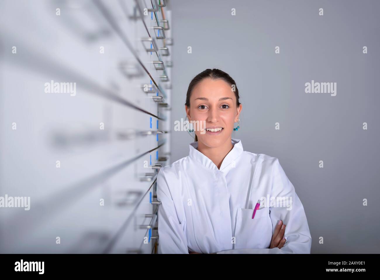 Environmental Portrait of a medical personnel, or doctor in pharmacy ...