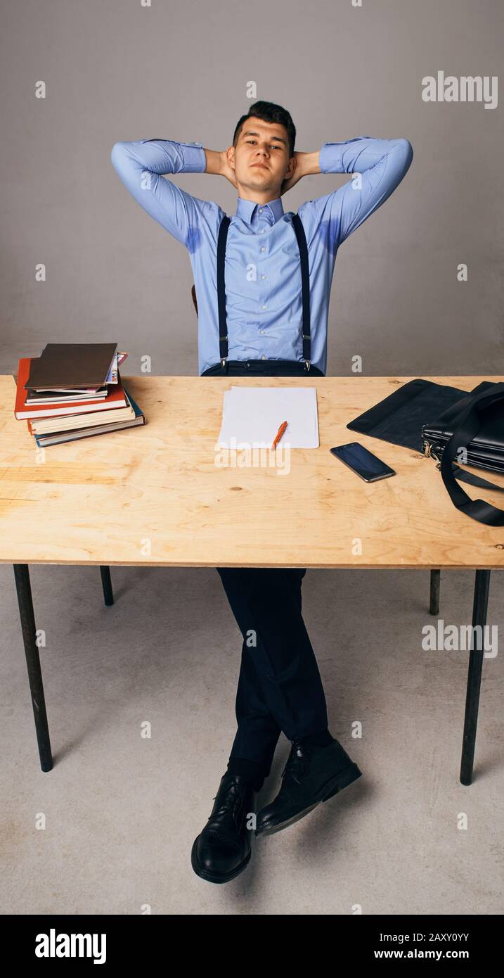 Man sitting desk full view hi-res stock photography and images - Alamy