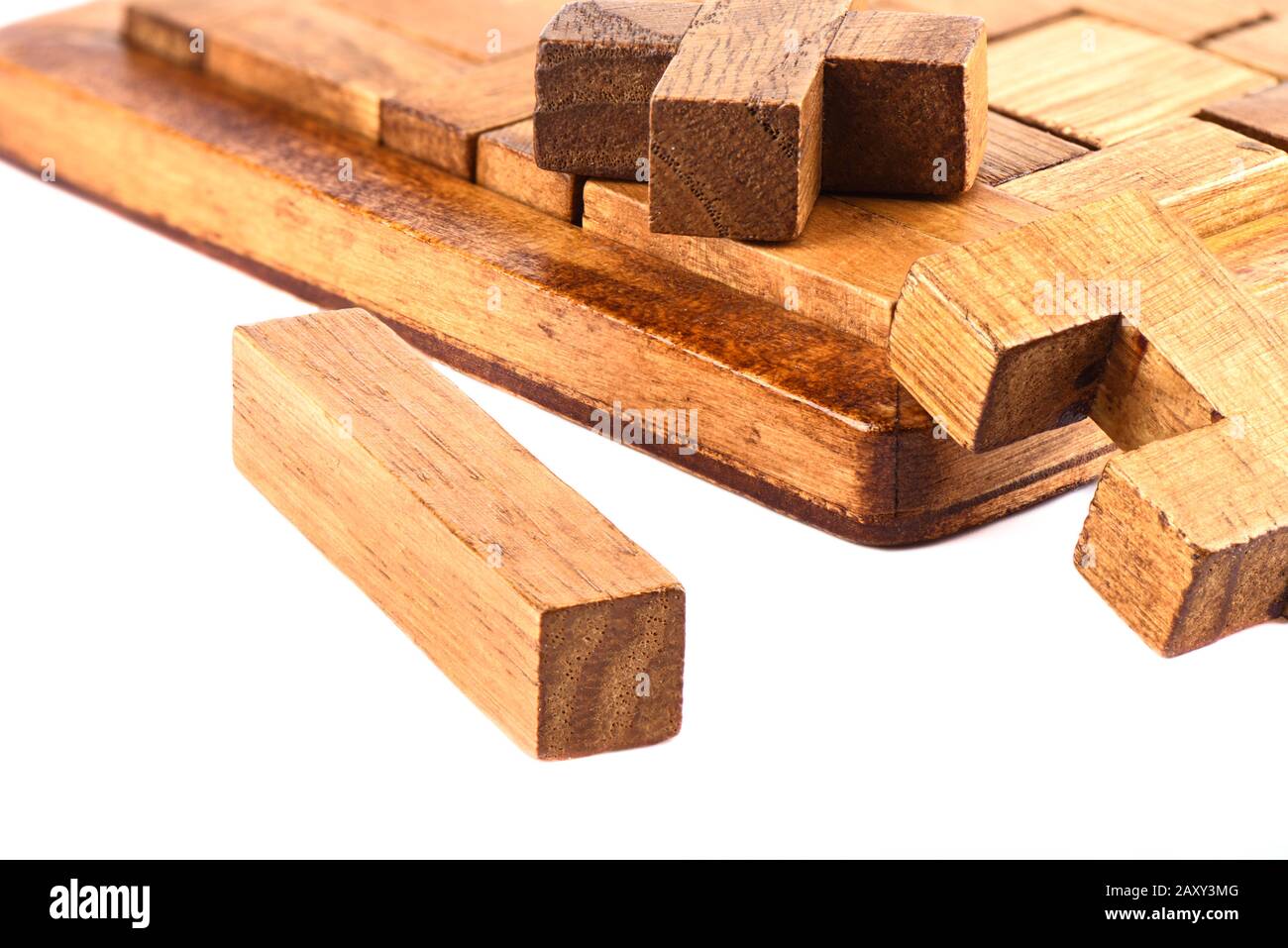 Macro shot. Three-dimensional wooden pentamino board game on a white ...