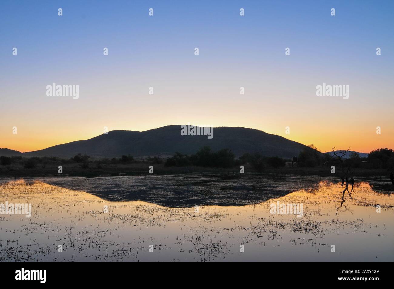 Sunset at Pilanesberg Nature Reserve looking over Mankwe Dam in South ...