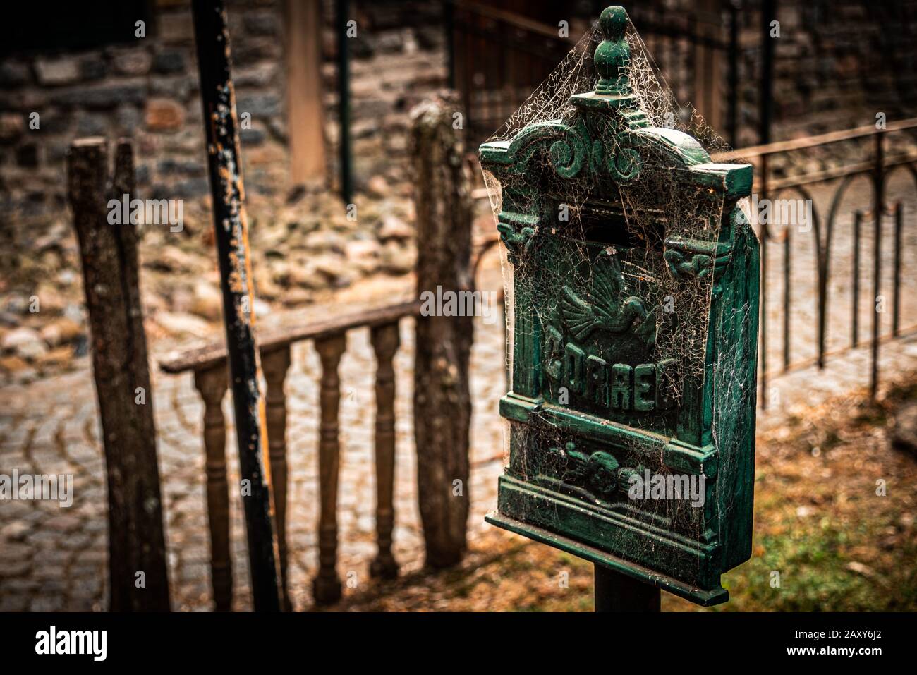 An antique mail box with an embossed figurine of a messenger pigeon ...