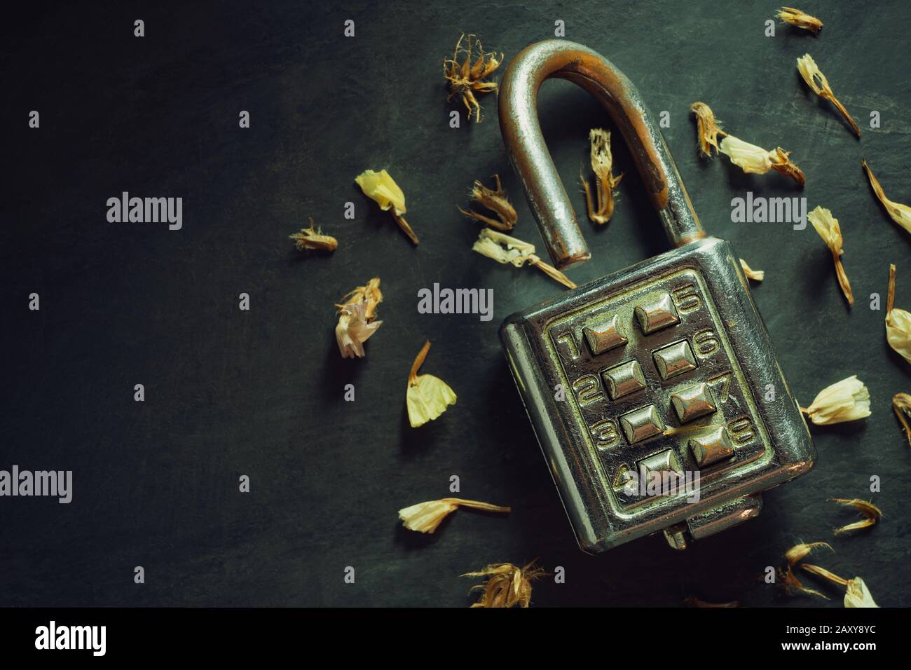 Combination padlock on blackboard background. Top view and copy space ...