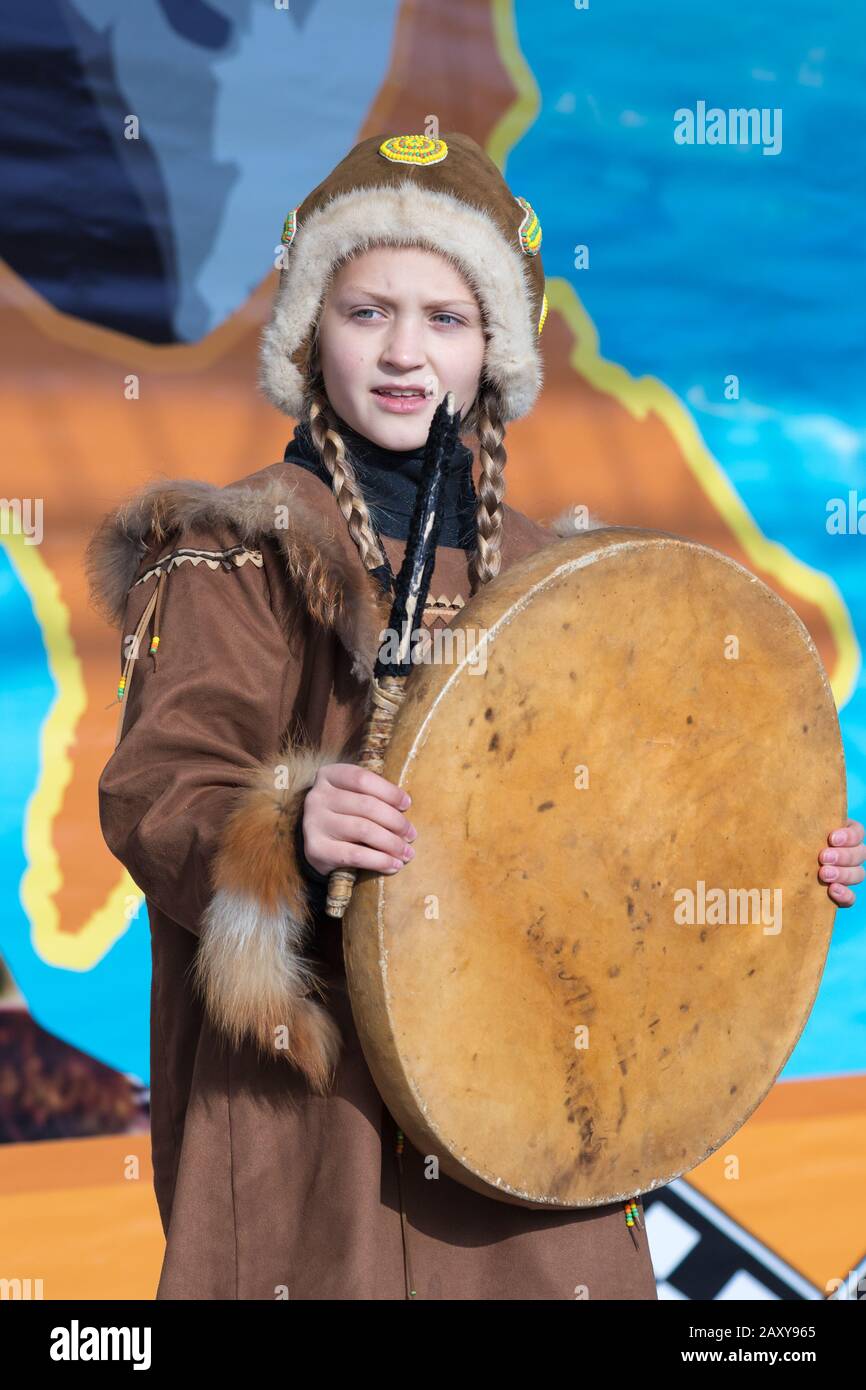 Girl dancing with tambourine in tradition clothing aboriginal people ...