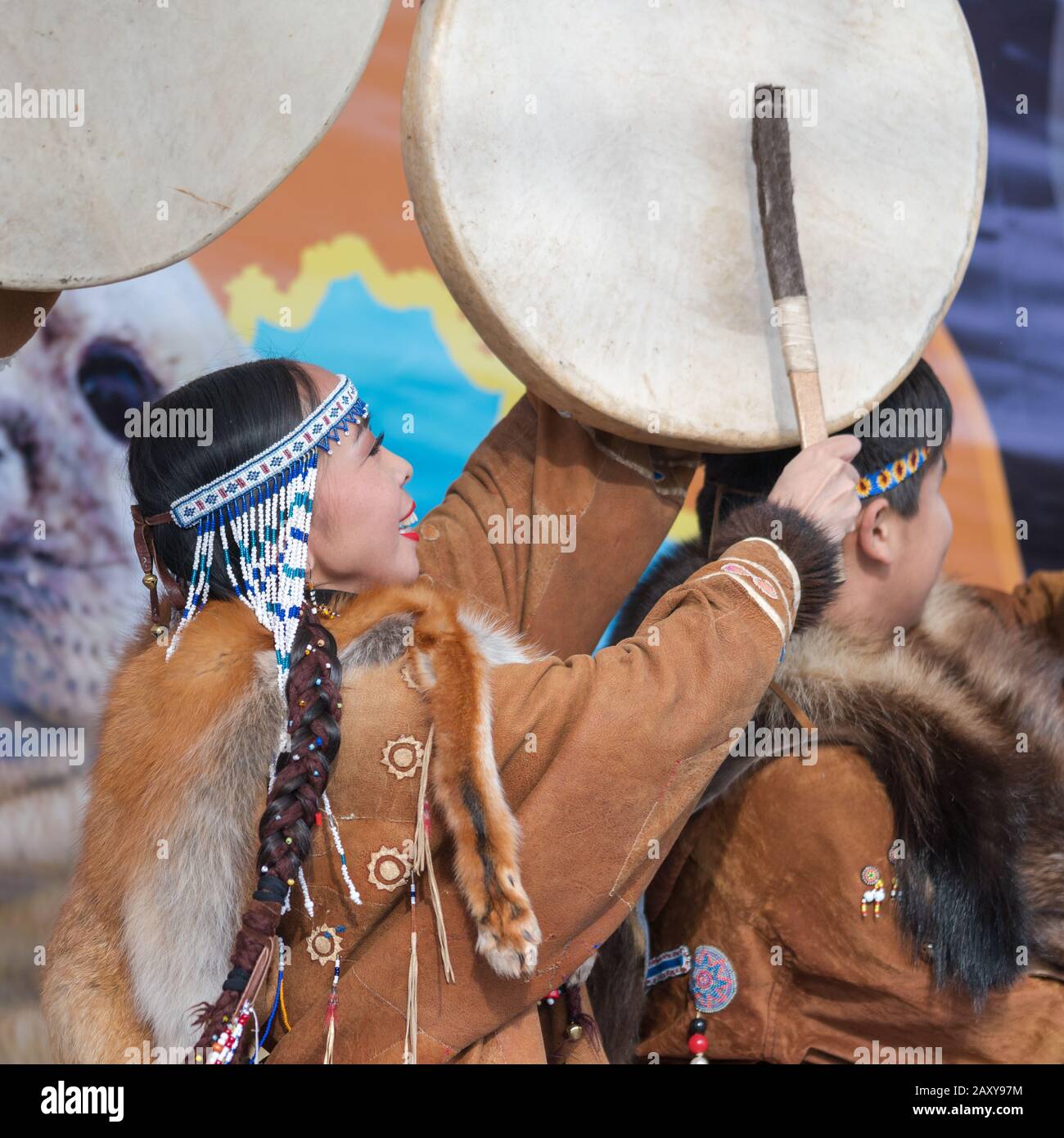 Female dancing with tambourine in tradition clothing indigenous ...