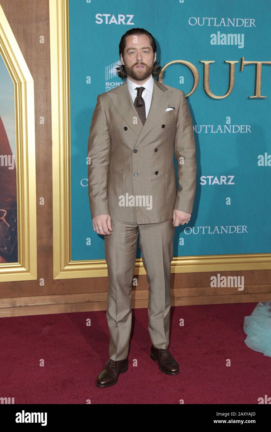 Richard Rankin walking the red carpet at the Starz Premiere Event For ...