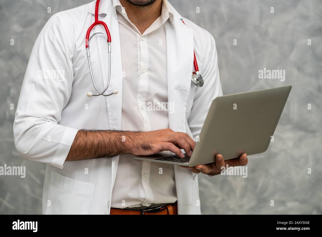 Doctor using laptop computer at the hospital. Medical healthcare and ...