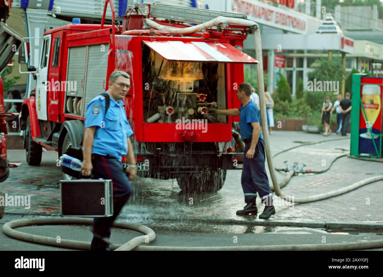 At the scene of a fire in a building. Firefighters Work Concept Stock ...