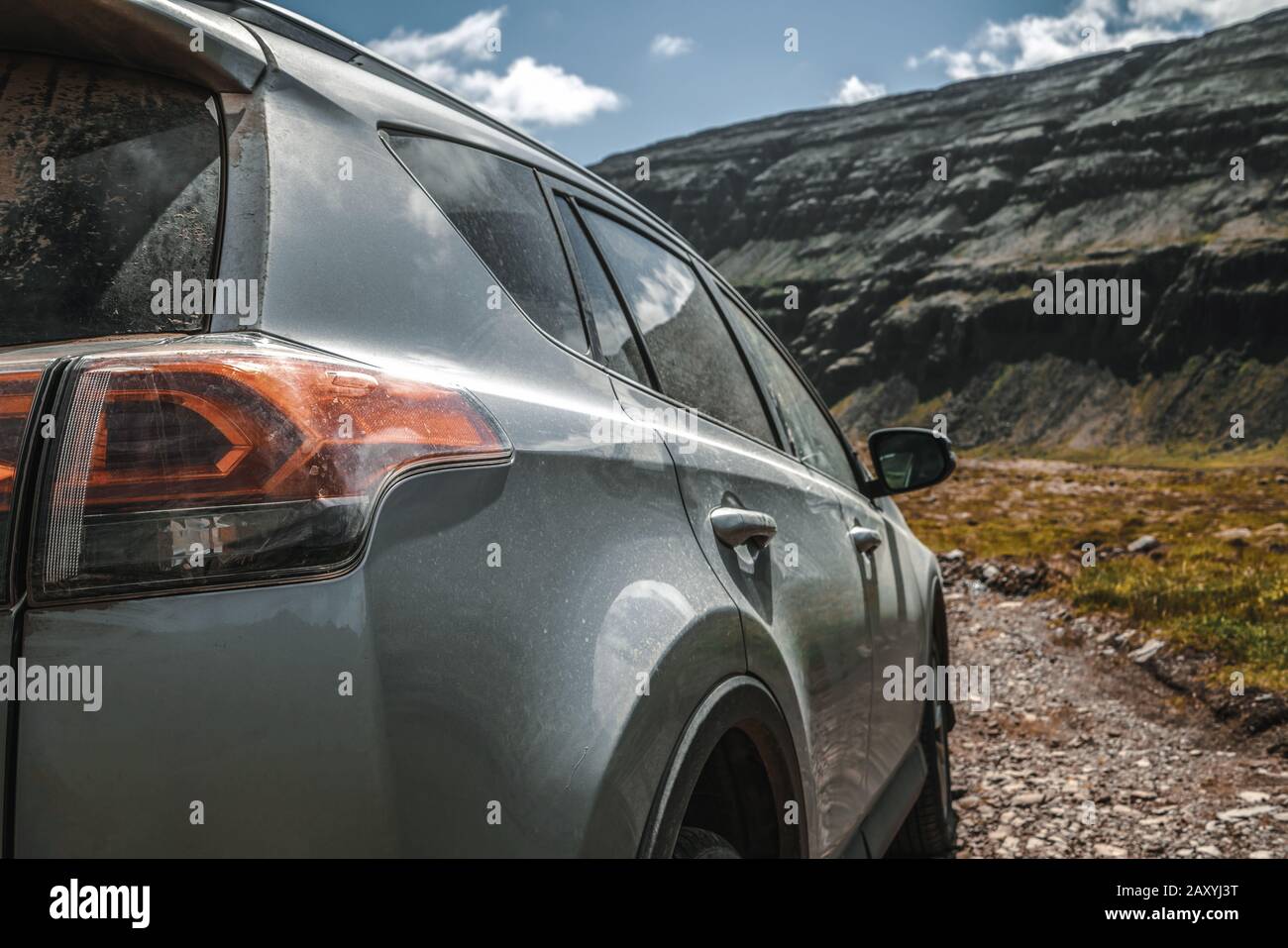 4WD SUV vehicle car running on gravel road with nature mountain ...