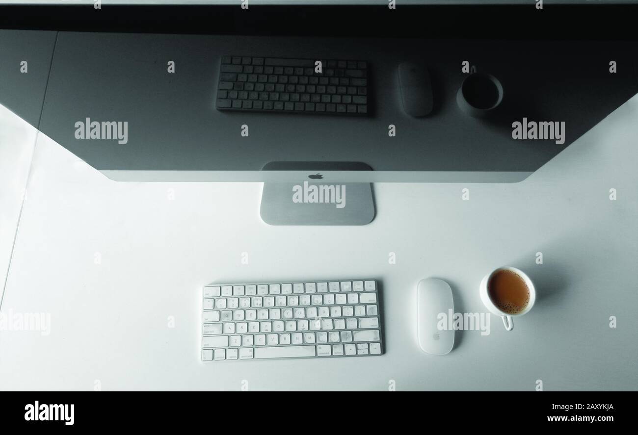 Desktop computer in the office with tea coffee Stock Photo - Alamy