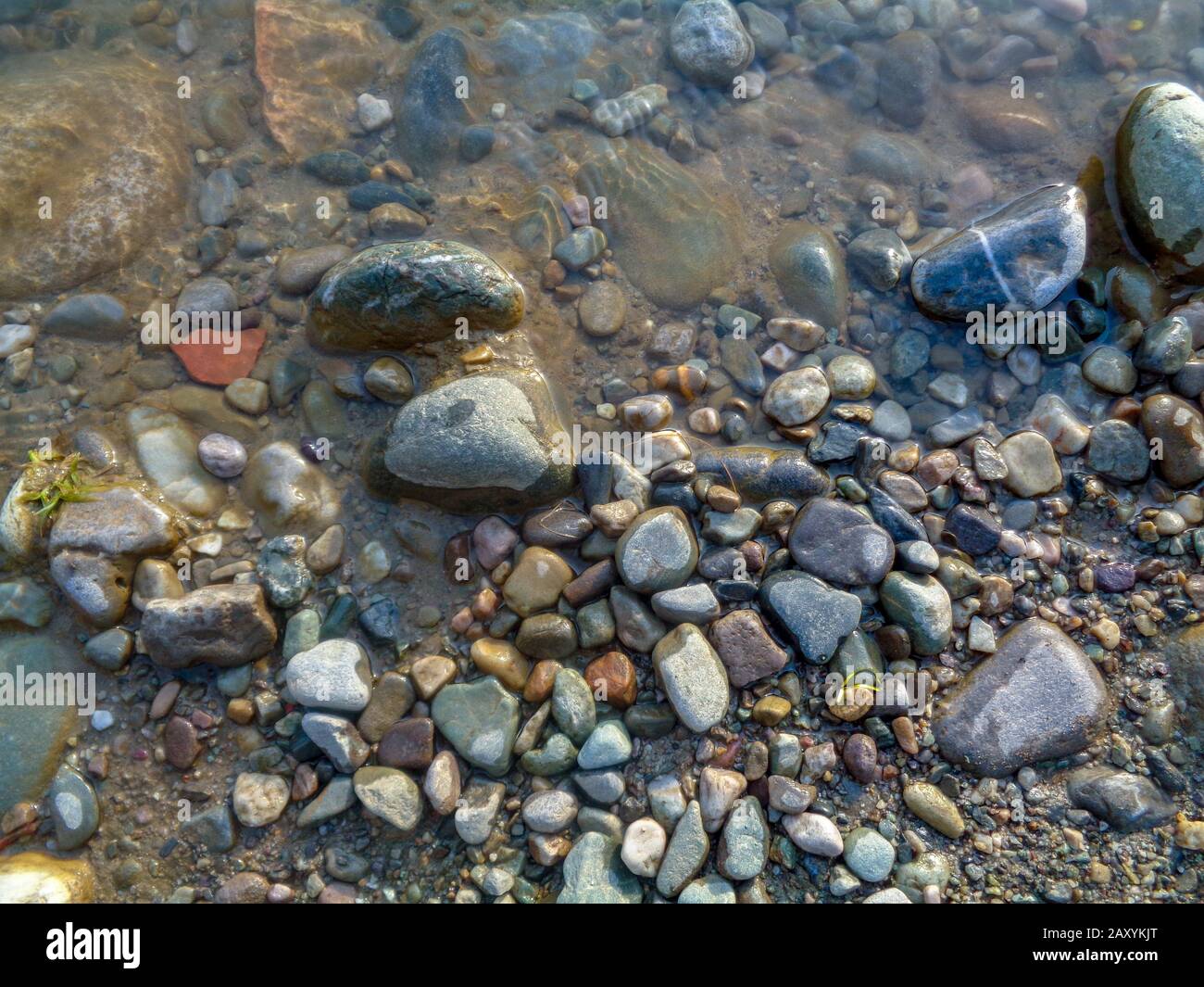Stone in the clean water Stock Photo - Alamy