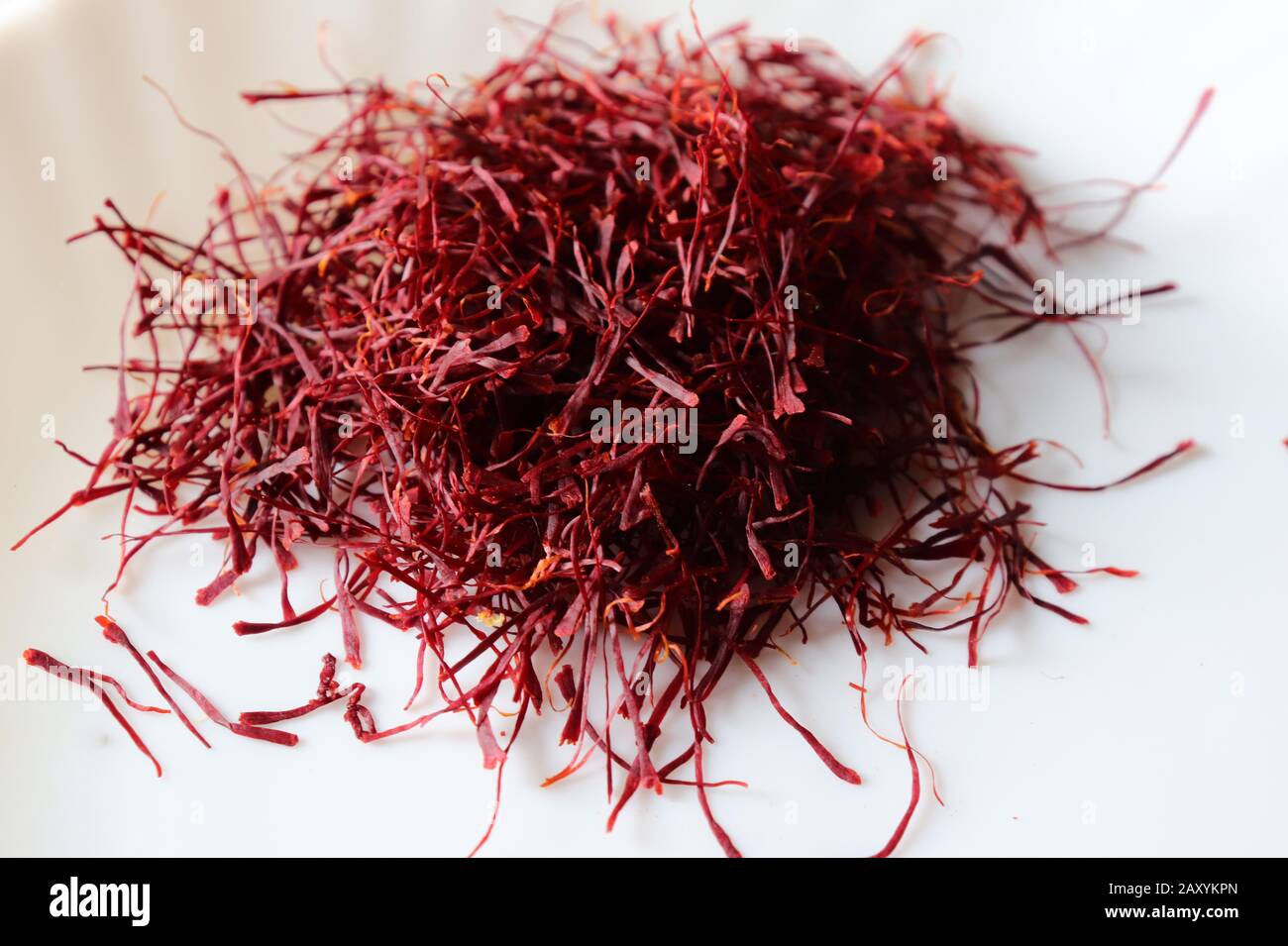 Close-up of Kashmiri saffron threads/kesar against white background ...