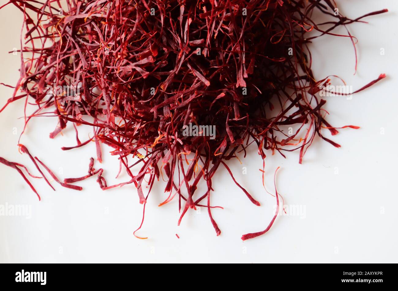Close-up of Kashmiri saffron threads/kesar against white background ...