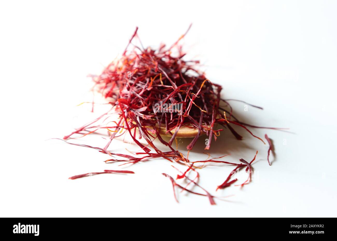 Close-up of Kashmiri saffron threads/kesar against white background ...