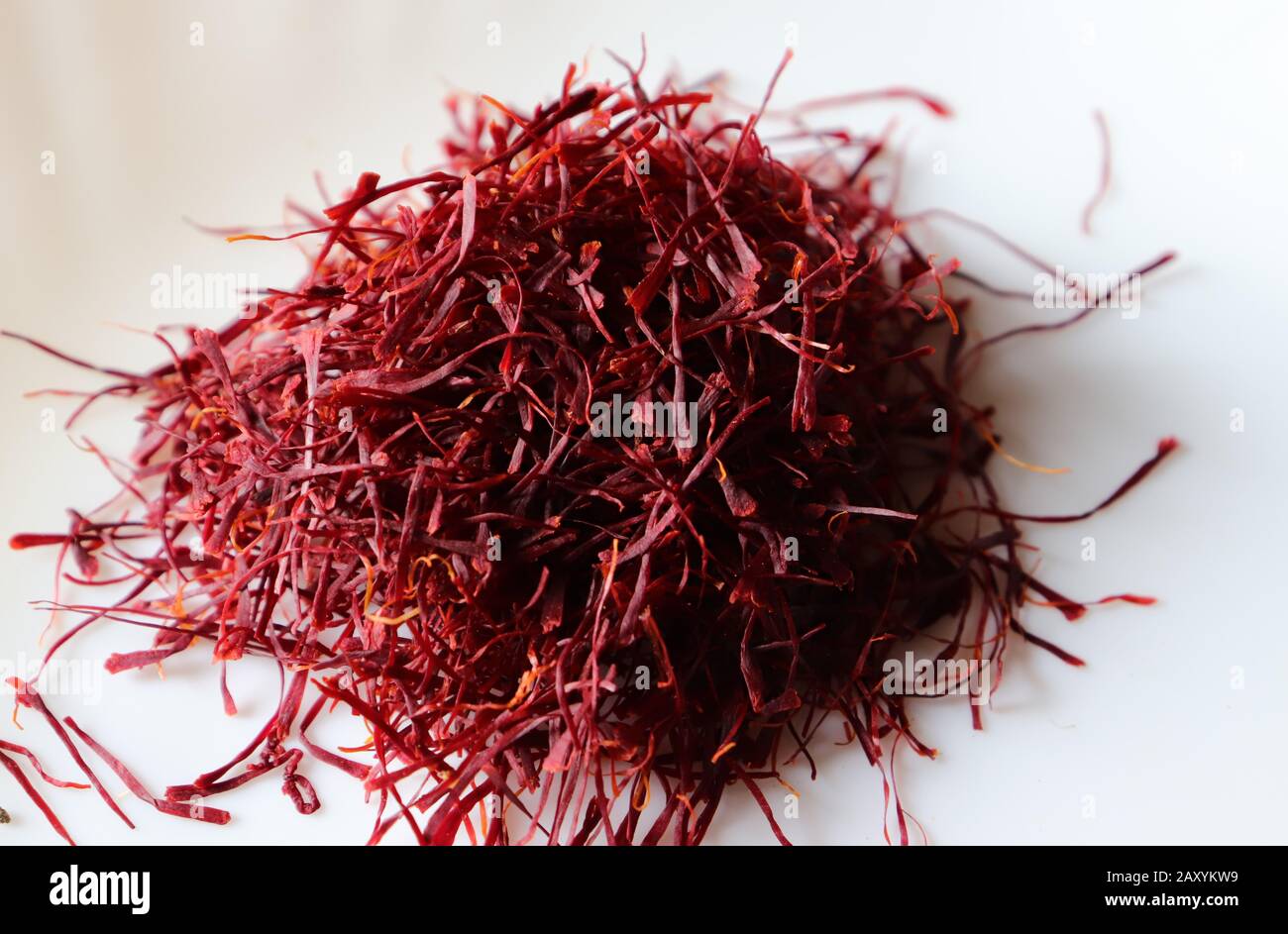 Close-up of Kashmiri saffron threads/kesar against white background ...
