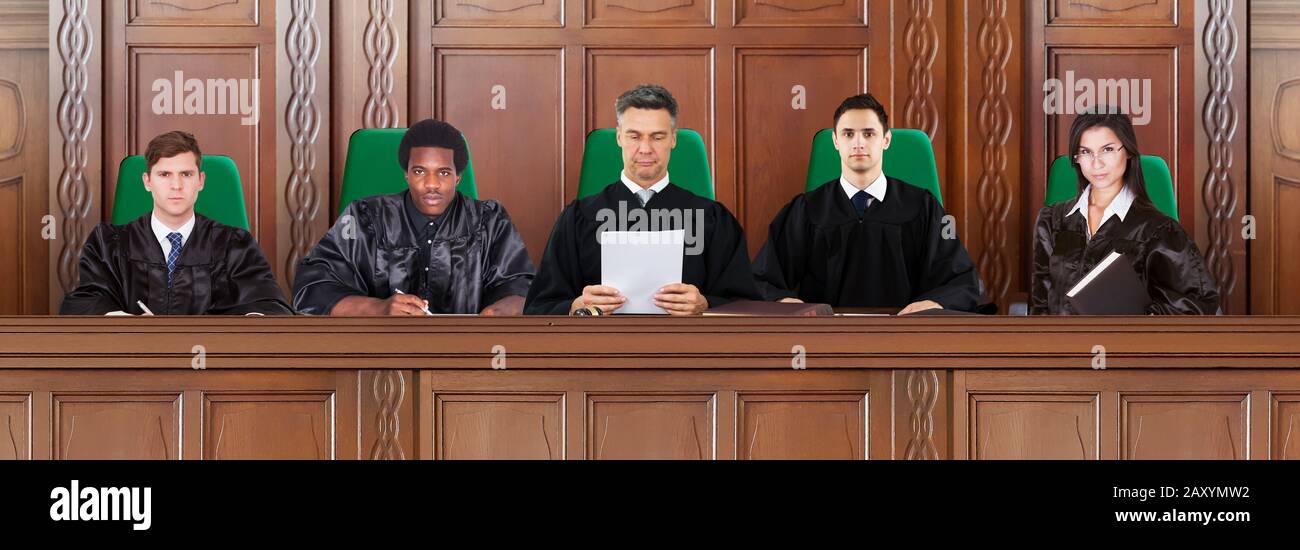 Judges Sitting In A Courtroom During Trial Hearings Stock Photo - Alamy