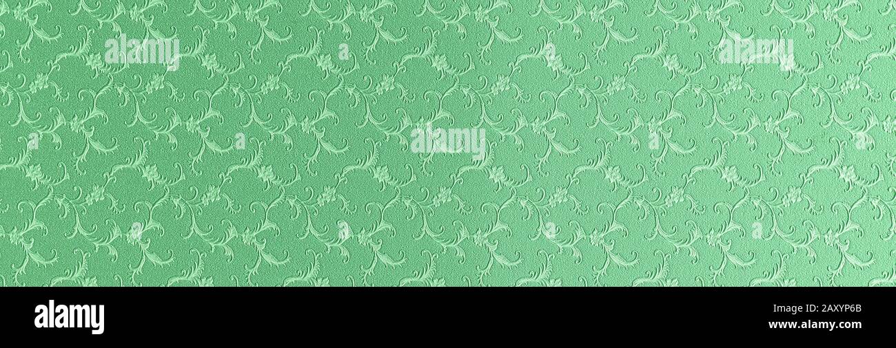 Embossed floral pattern on green paper. Textured paper with copy space ...