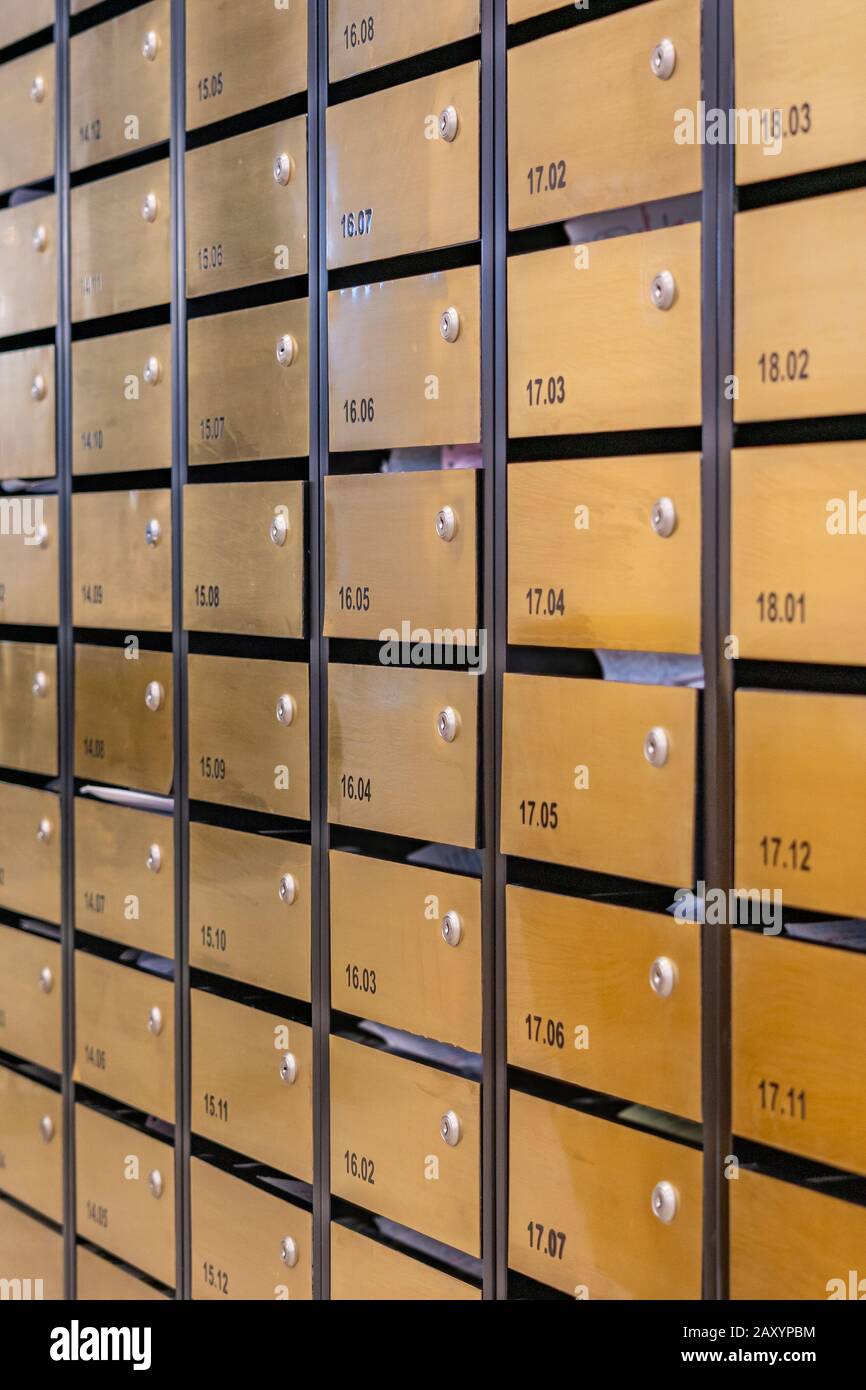 Vertical photo of mailbox array at postal room in condominium Stock ...