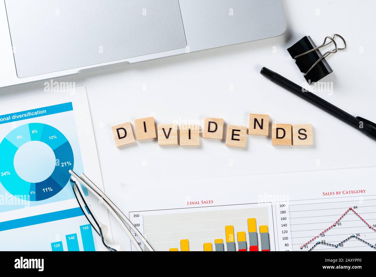 Dividends payment concept with letters Stock Photo - Alamy