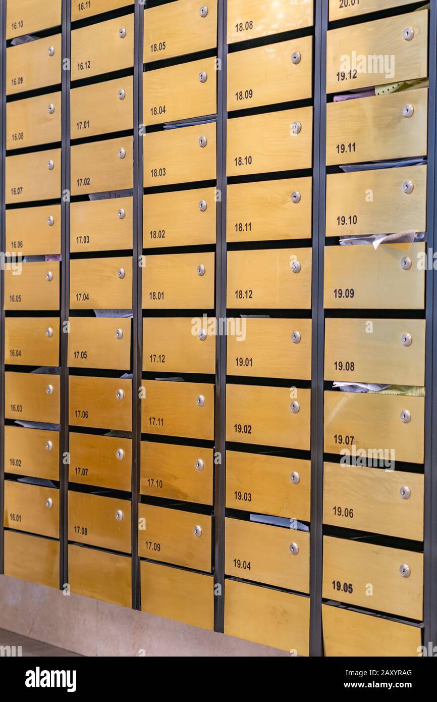 Metallic letter mailbox array at condominium entrance hall Stock Photo ...