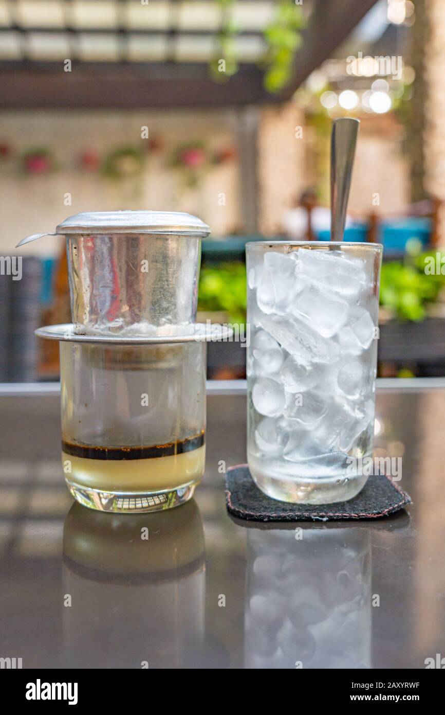 Vietnamese dripping filter condensed milk coffee and ice Stock Photo ...