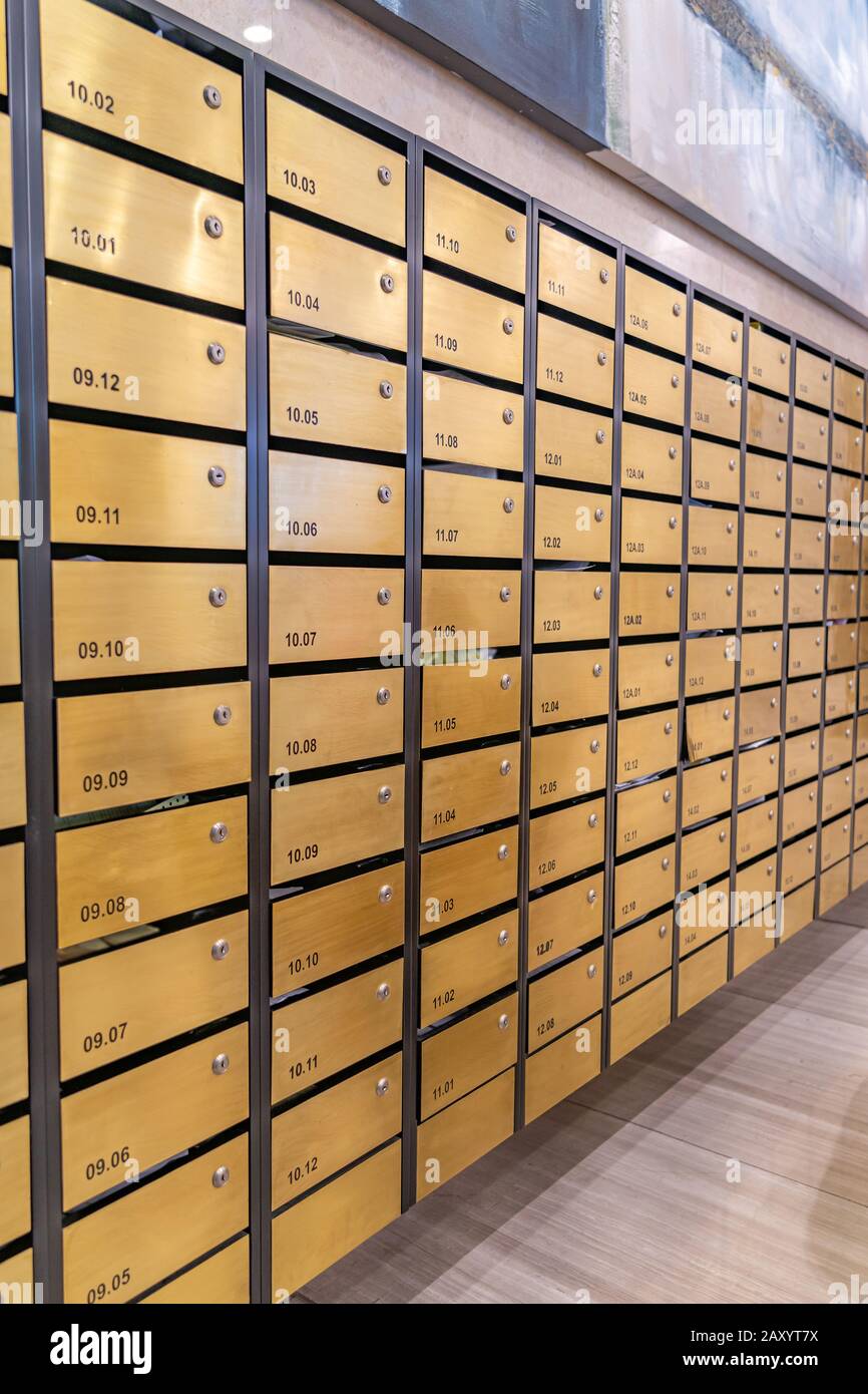 Metallic letter mailbox rows in postal room facilities of condominium ...