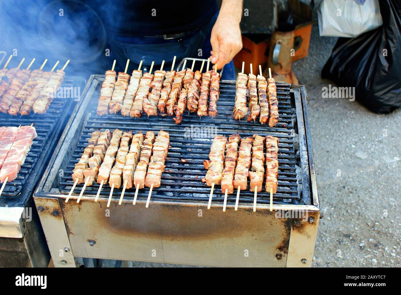 Outdoor barbecue, pork meat grilled Stock Photo - Alamy