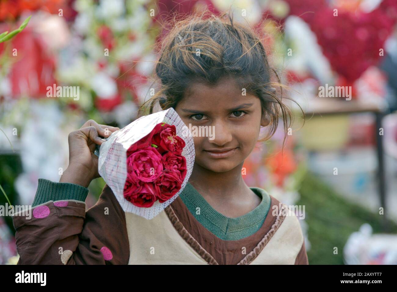 Lahore, Pakistan. 13th Feb, 2020. Pakistani flower vendor displays ...