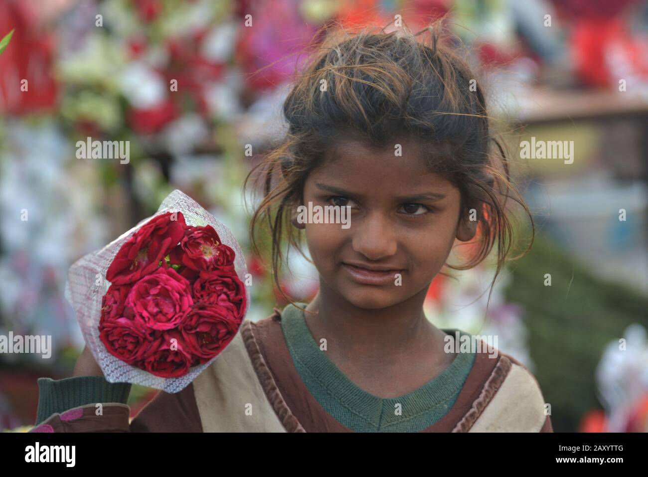 Lahore, Pakistan. 13th Feb, 2020. Pakistani flower vendor displays ...