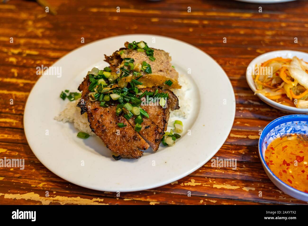Vietnamese pork chop rice served with pickles and fish sauce Stock ...