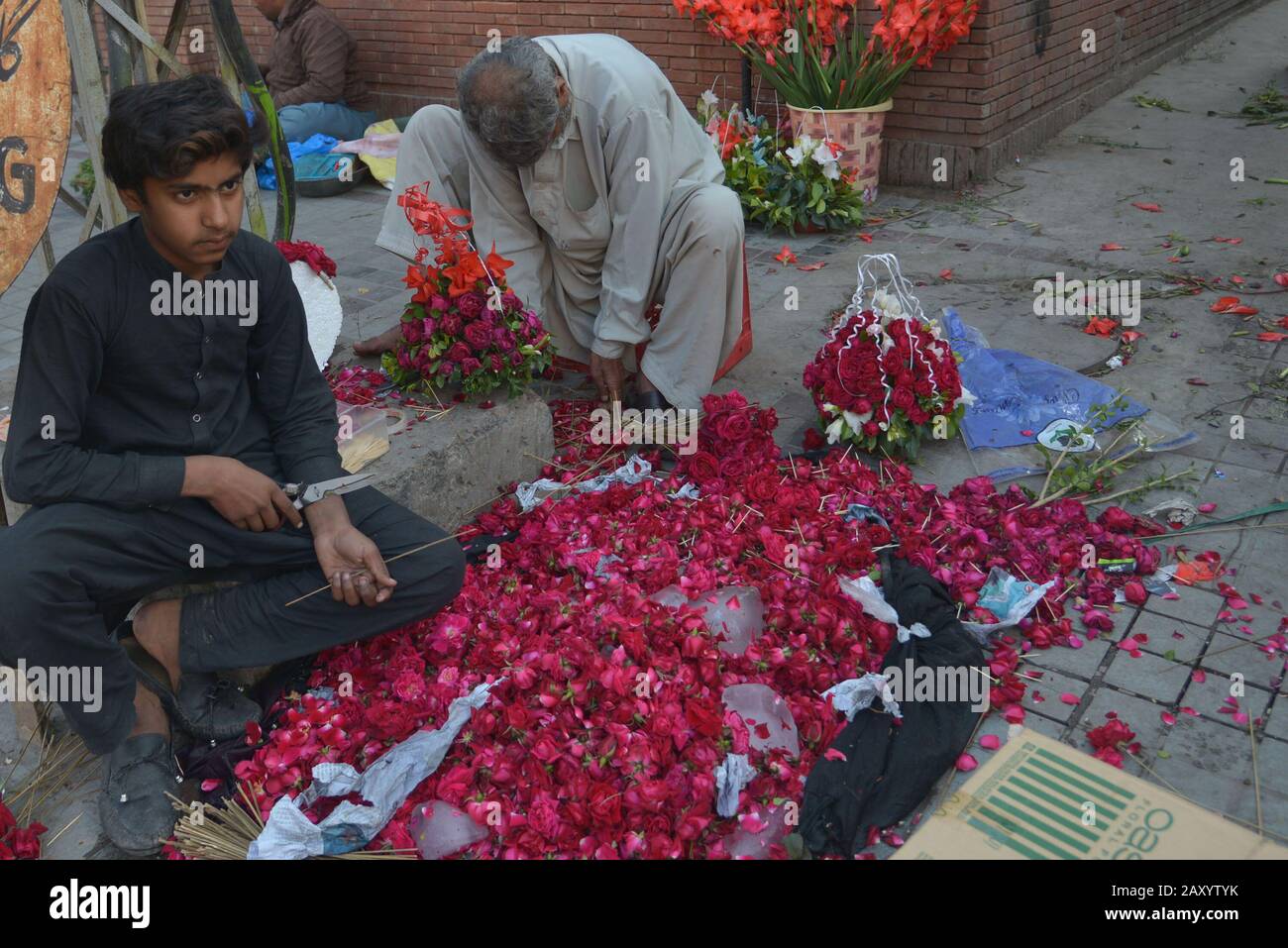 Lahore, Pakistan. 13th Feb, 2020. Pakistani flower vendor displays ...
