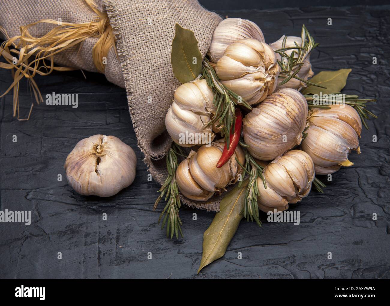 A beautiful bouquet of fresh garlic with red pepper and Bay leaves ...