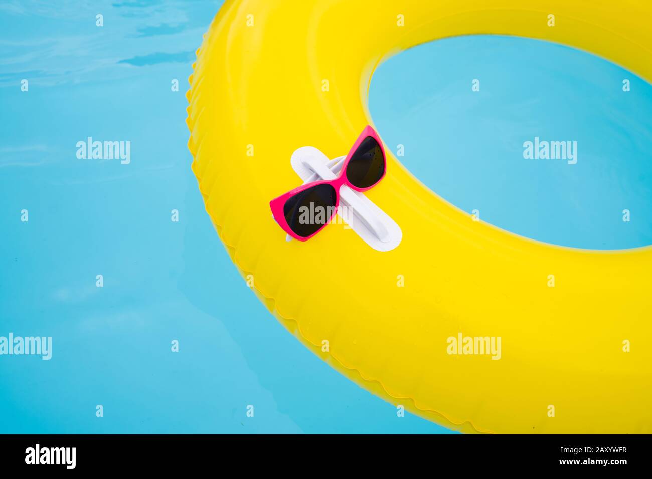 Sunglasses Attached To Ring In Swimming Pool Stock Photo - Alamy
