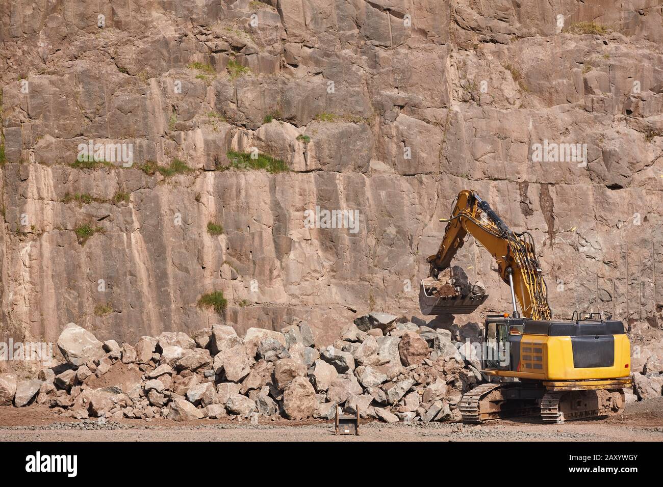 Excavator working on a stone quarry. Geological and mineral excavation ...