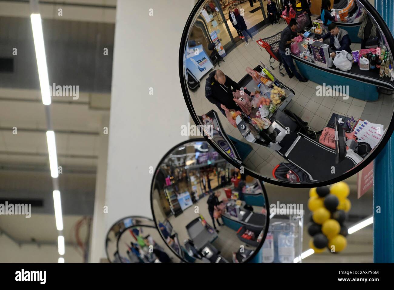 Shoppers reflected in mirrors at Rami Levy branch located in Atarot ...