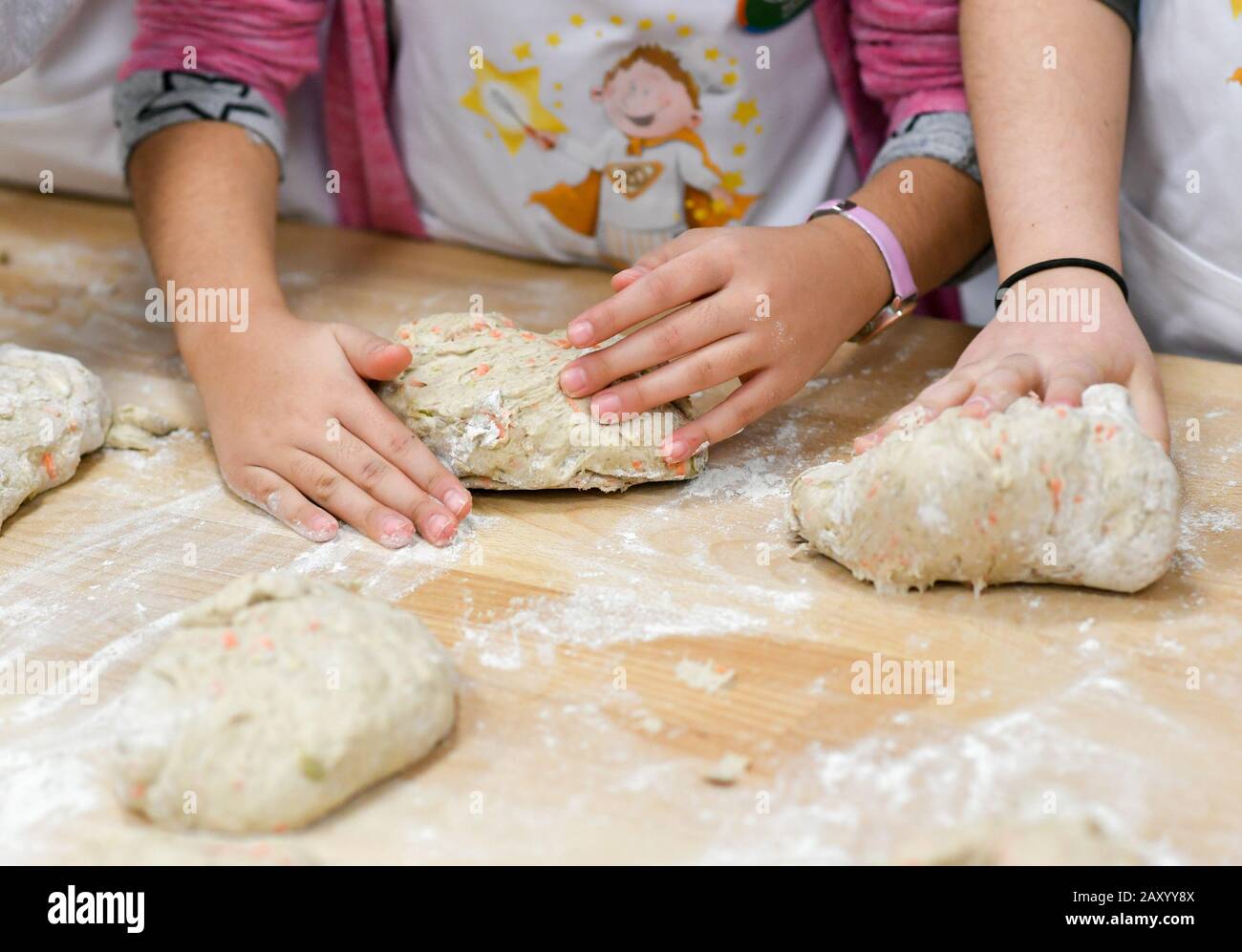 Berlin, Germany. 13th Feb, 2020. Primary school children bake their own ...