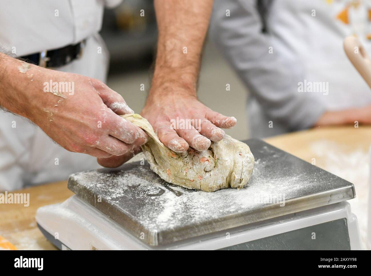 Berlin, Germany. 13th Feb, 2020. A baker shows primary school children ...