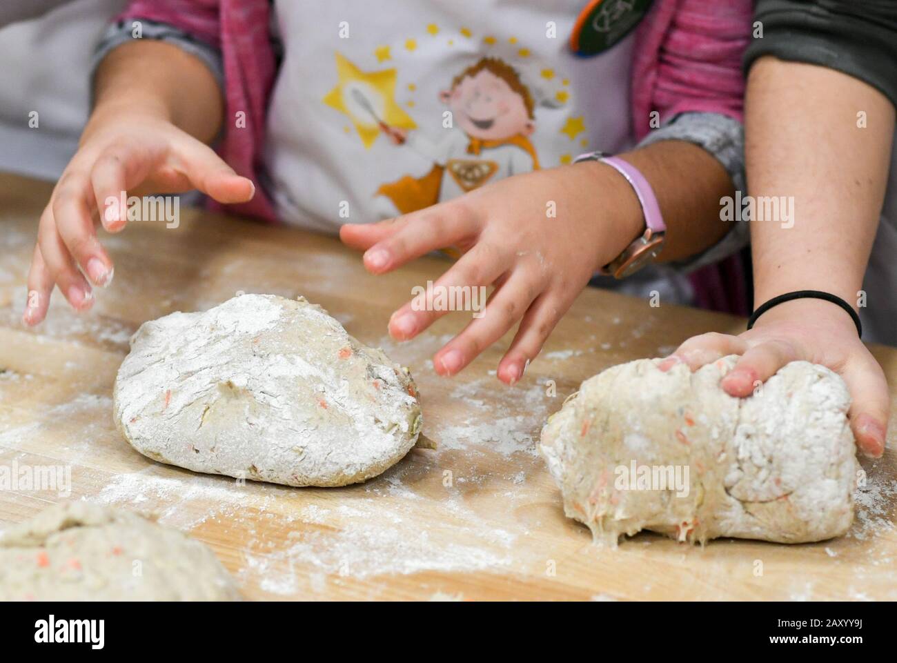Berlin, Germany. 13th Feb, 2020. Primary school children bake their own ...