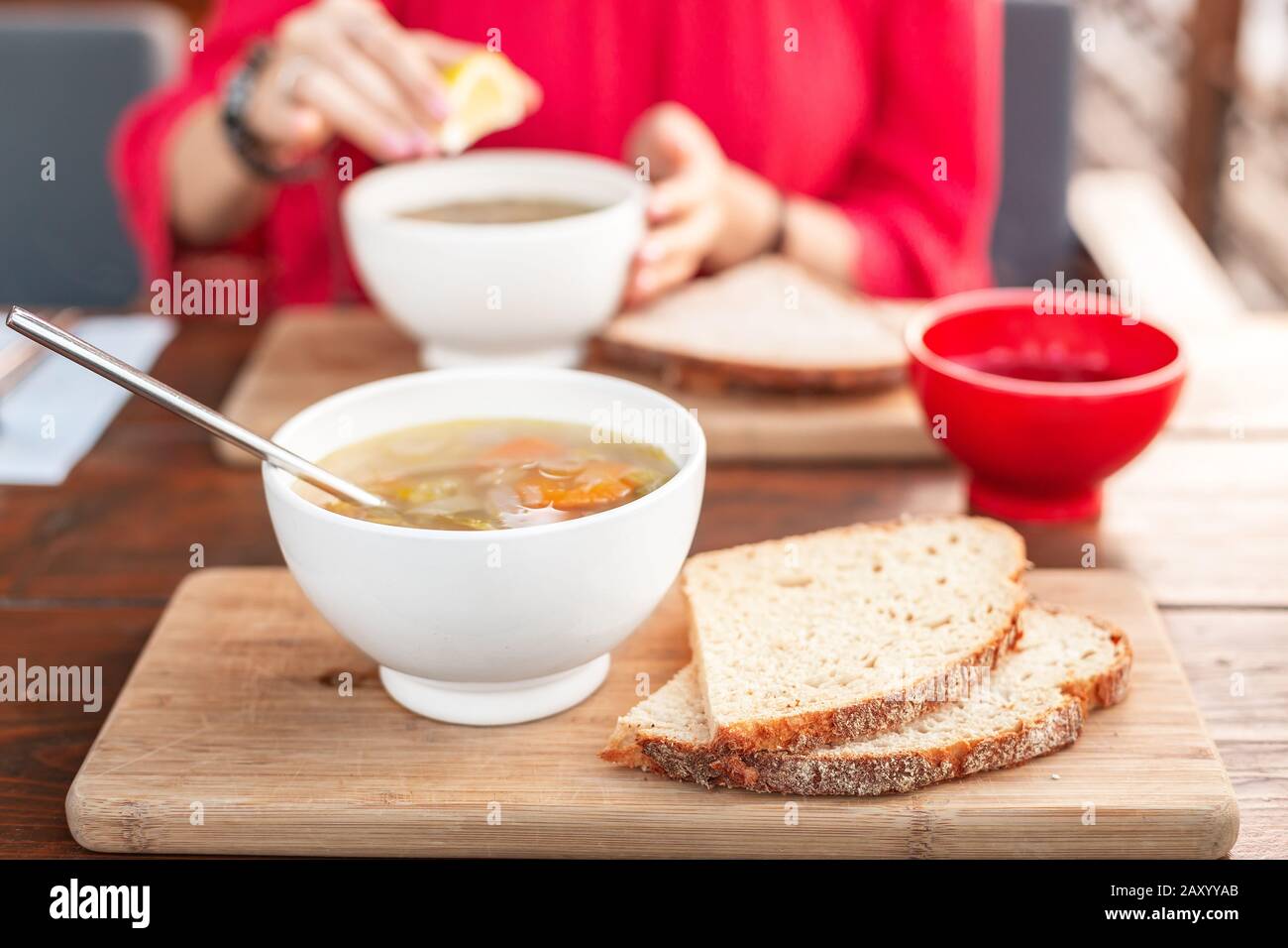 Eating vegetarian soup in outdoor cafe Stock Photo - Alamy