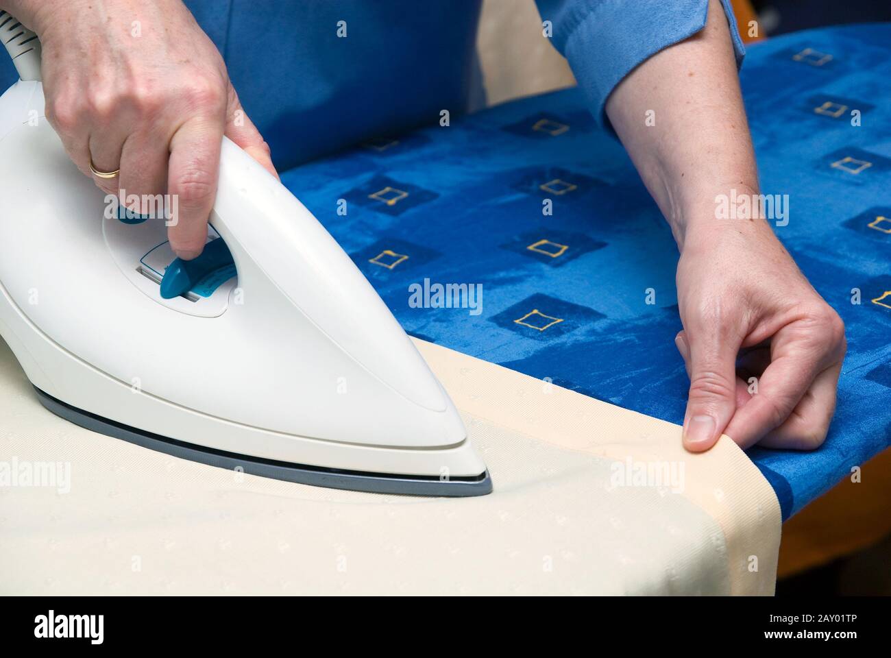 Women's hands with iron Stock Photo - Alamy