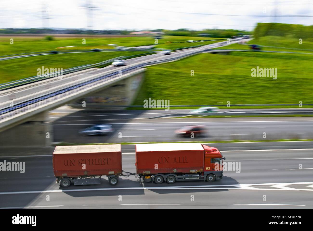 Road train at motorway junction Stock Photo - Alamy