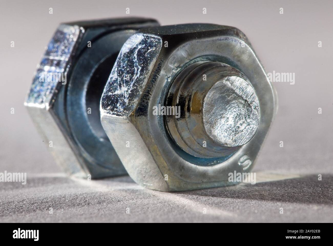 Metal screw with nut Stock Photo - Alamy