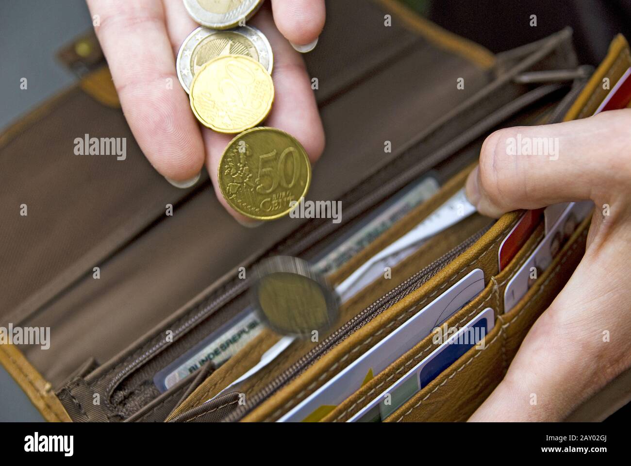 Wallet and small change Stock Photo - Alamy