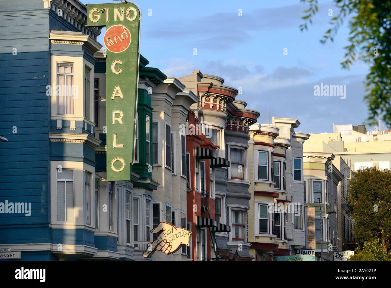 Victorian houses and old neon signs of the Pizzeria Gino and Carlo ...