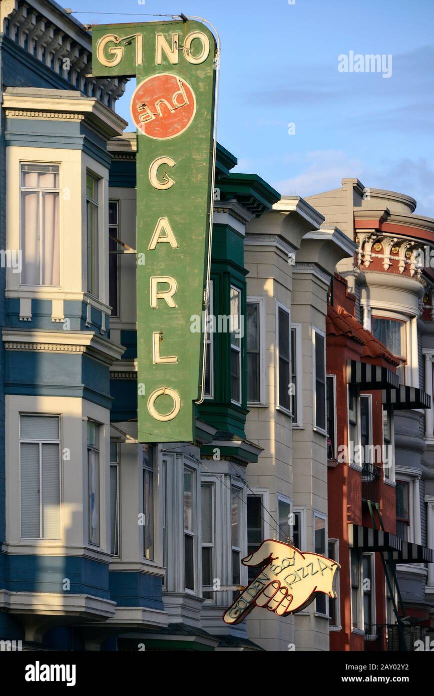 Victorian houses and old neon signs of the Pizzeria Gino and Carlo ...