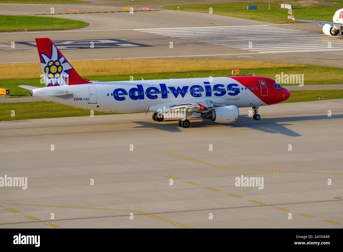 Edelweiss airlines airplane preparing for landing at day time in ...