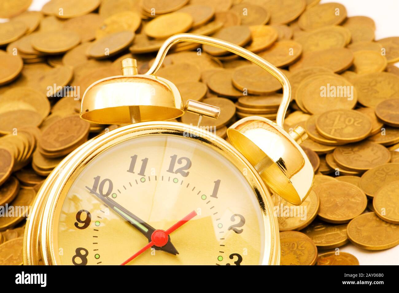 Time is money concept with clock and coins Stock Photo - Alamy