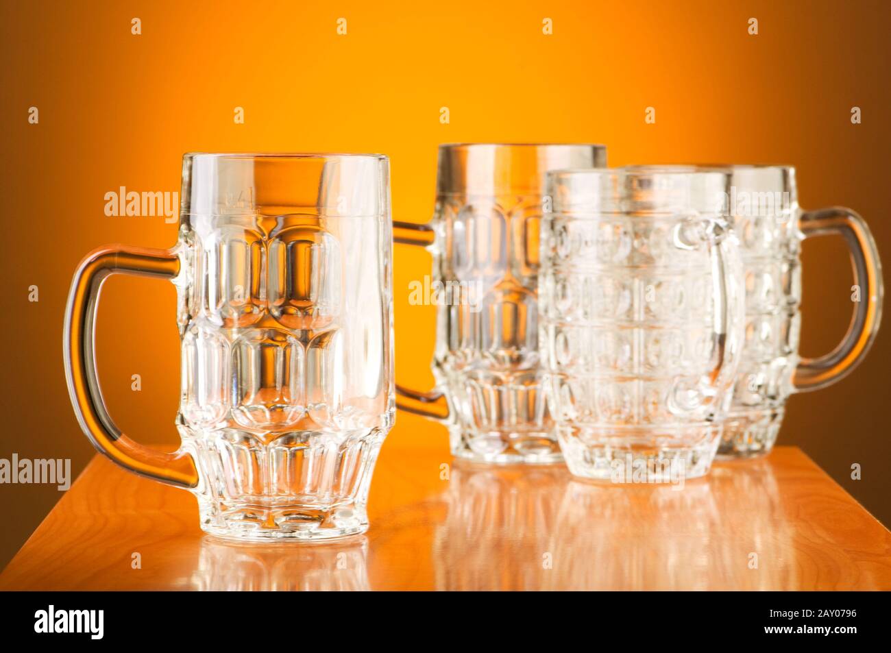 Beer glass against gradient background Stock Photo - Alamy