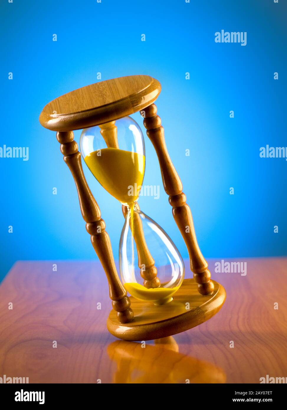 Time concept with hourglass against background Stock Photo - Alamy