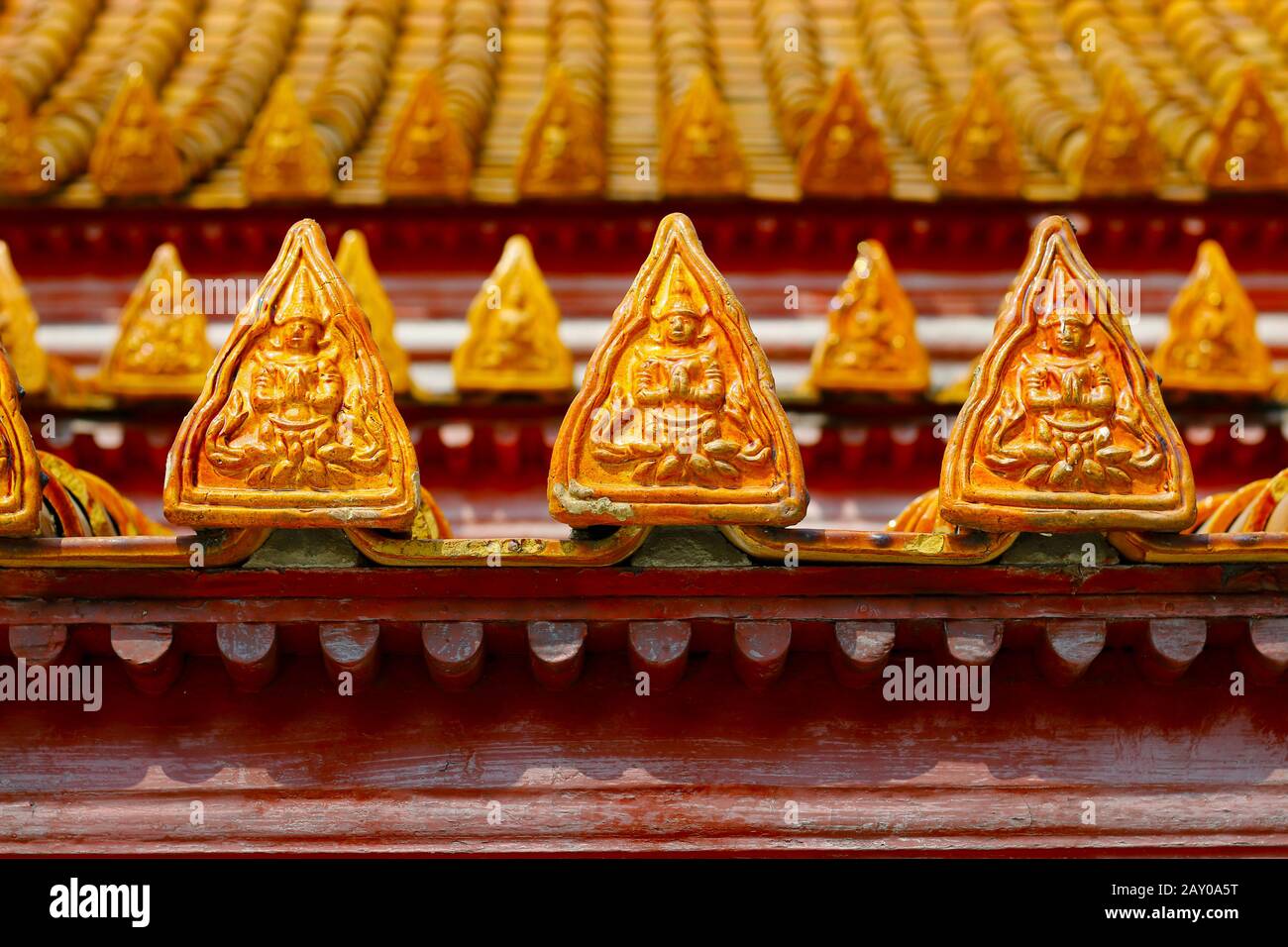 orange roof tiles on buddhist temple with design of buddha Stock Photo ...