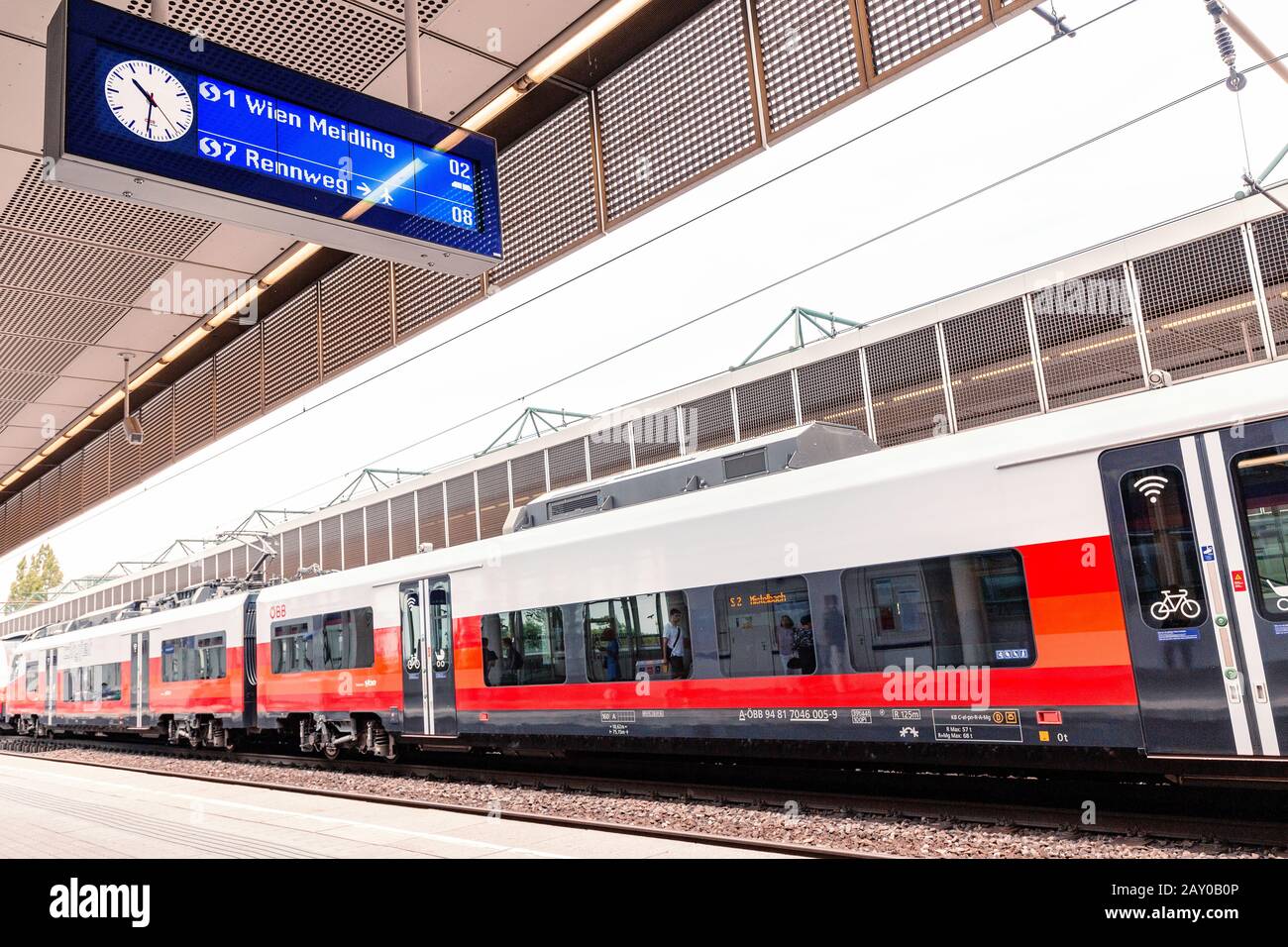 21 July 2019, Vienna, Austria: S-bahn city train waiting on a platform ...